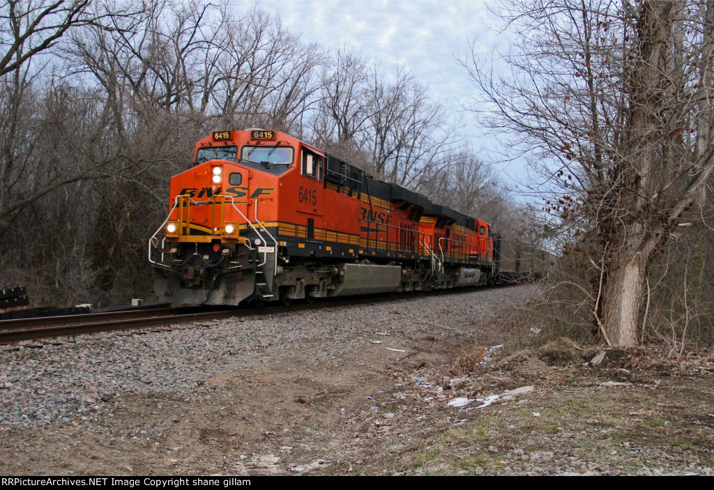 BNSF 6415 heads up a empty coal train Nb.